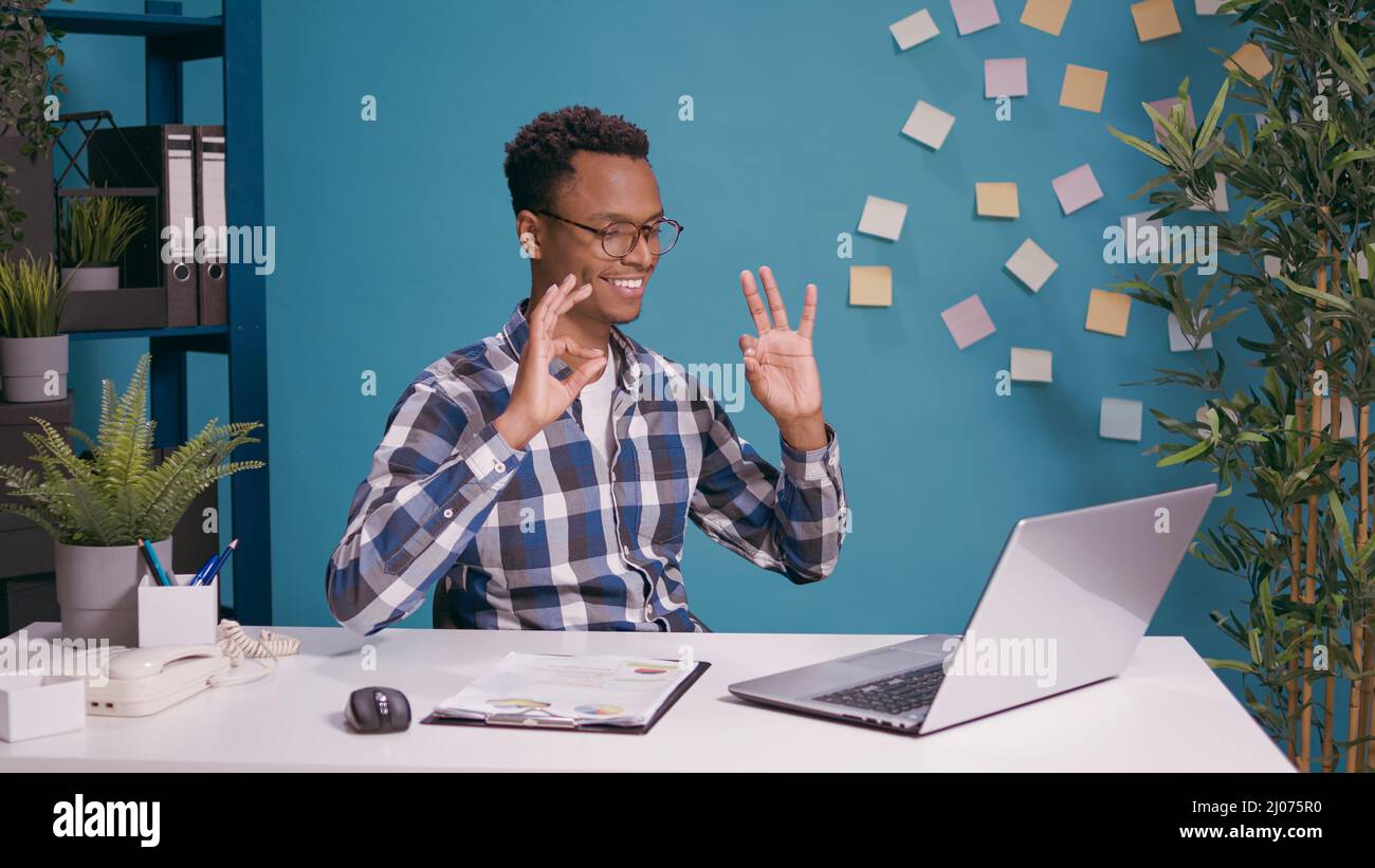 African american person showing okay and approval sign with hands in ...