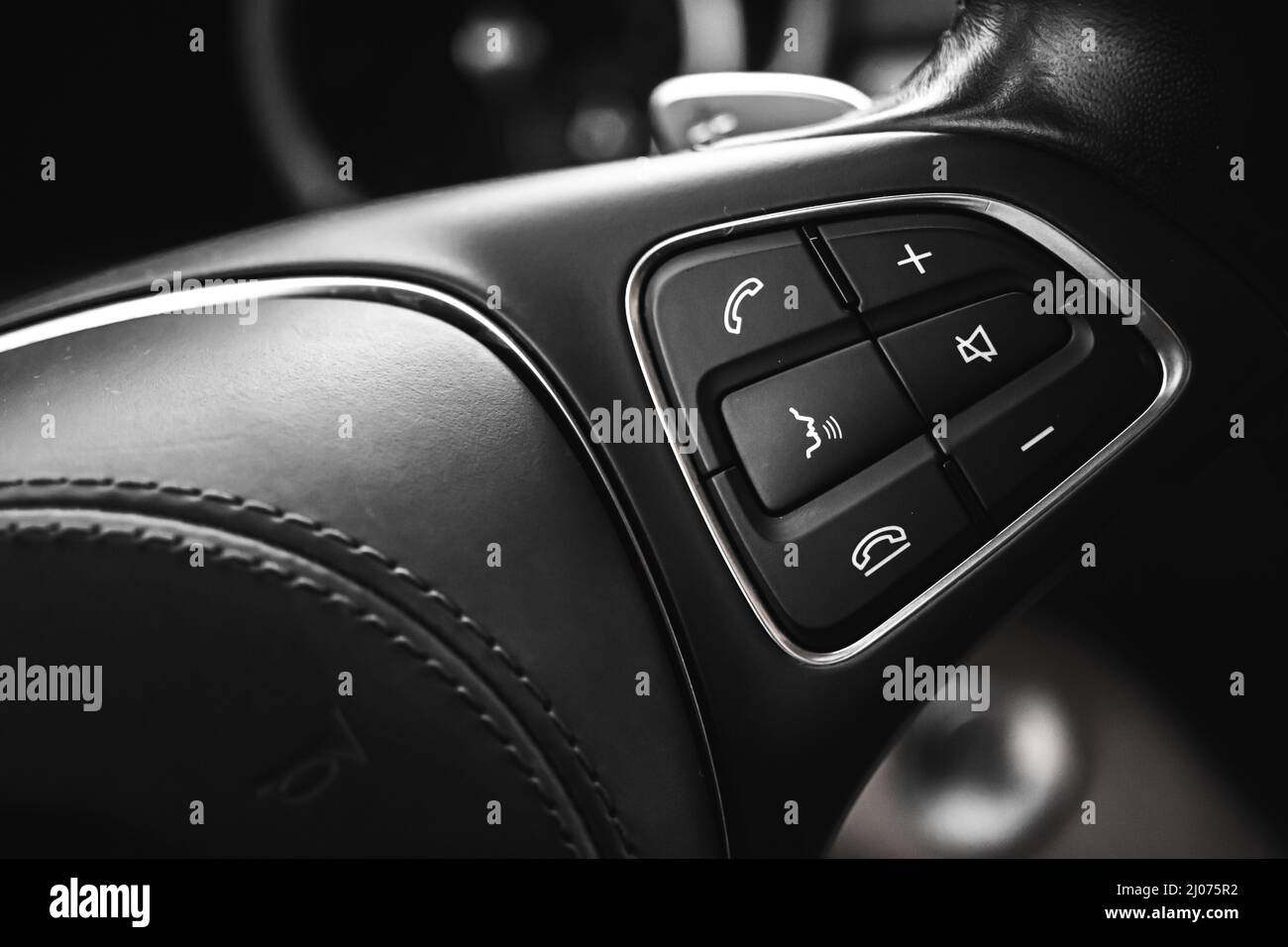 Steering wheel controls button inside luxury car with leather interior ...
