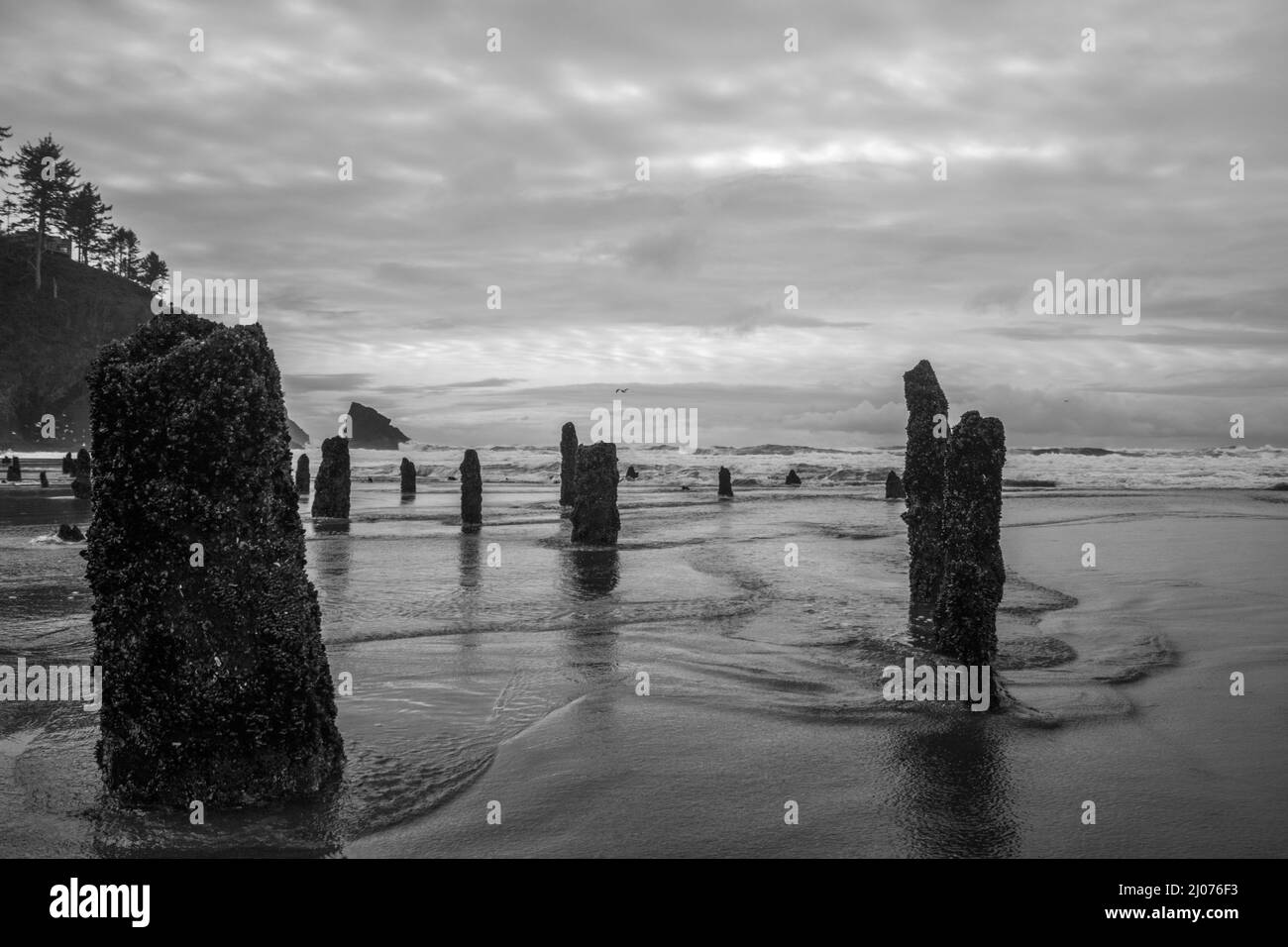 Photo of rocks standing on ocean pier Stock Photo - Alamy