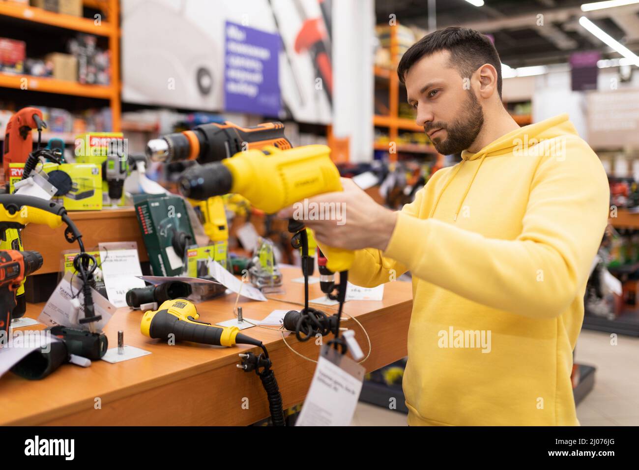 Man shopping power drill hi-res stock photography and images - Alamy