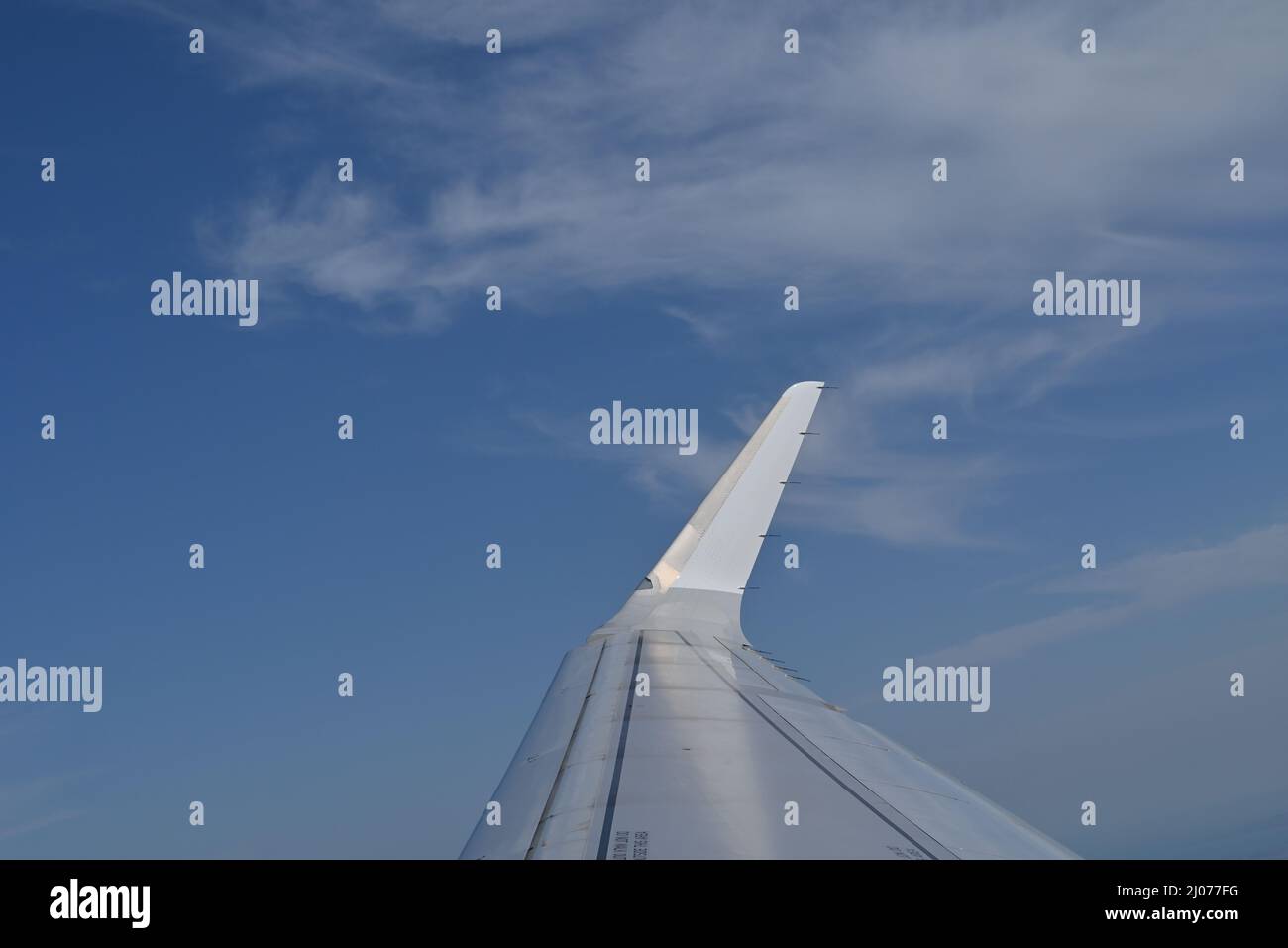 Photo of an airplane wing from a window Stock Photo - Alamy