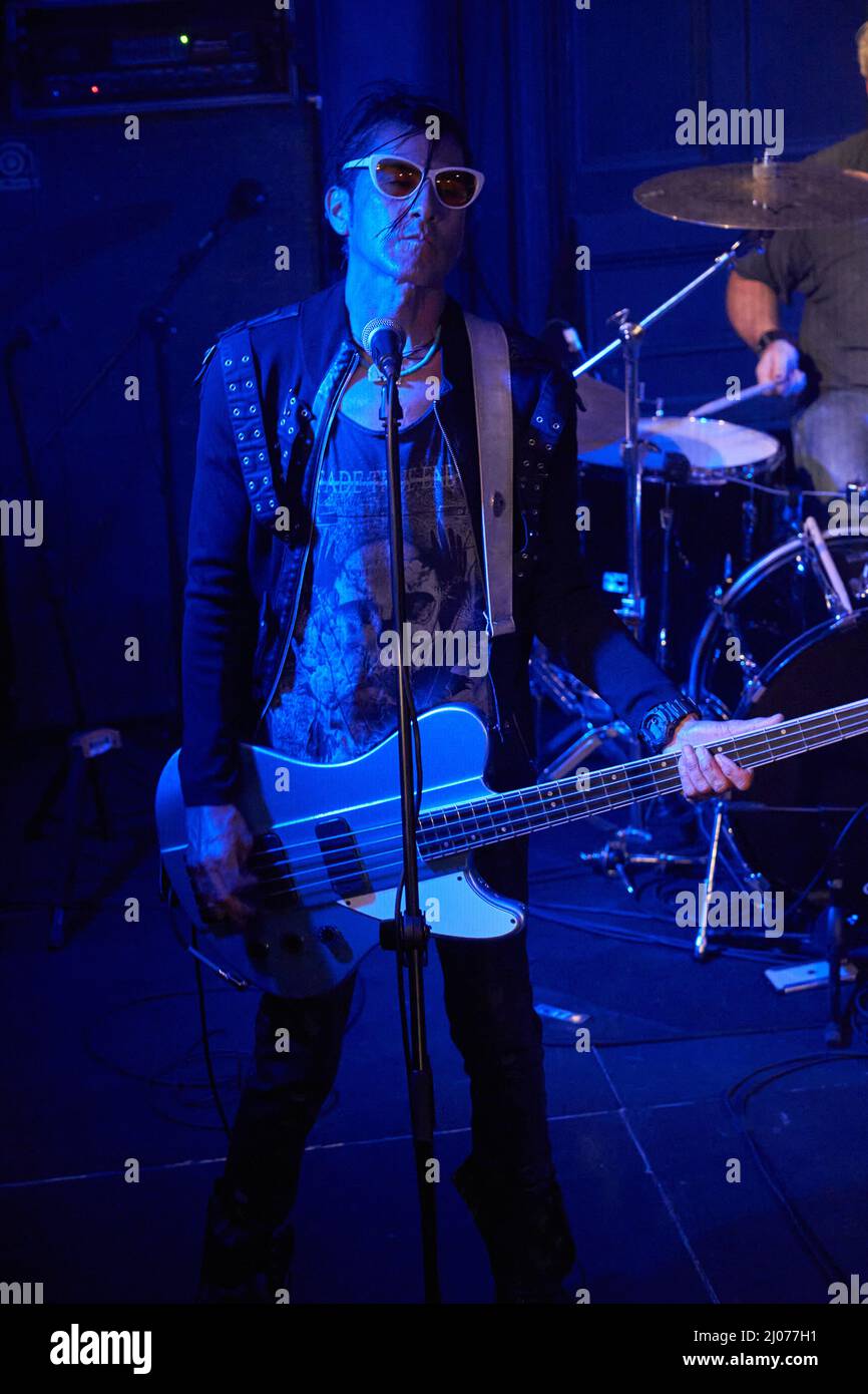 Bassist Pando performing with eighties New Wave band A Flock of ...