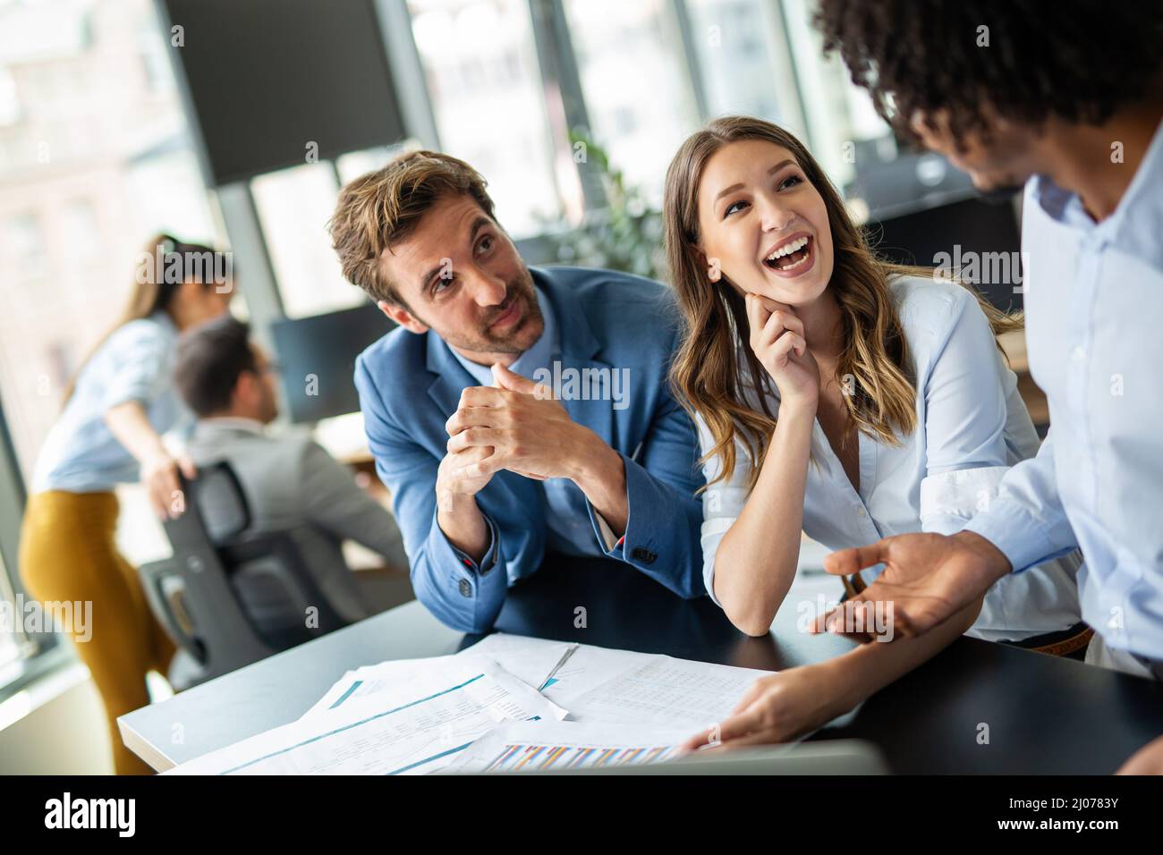 Group of successful multiethnic business people celebrating a good job ...