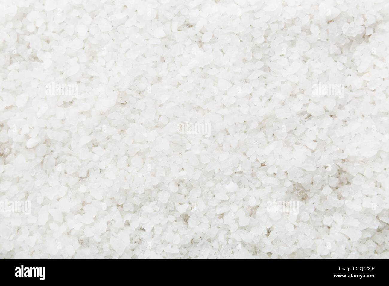 Background from white sea salt. Coarse rock salt texture witth copy ...