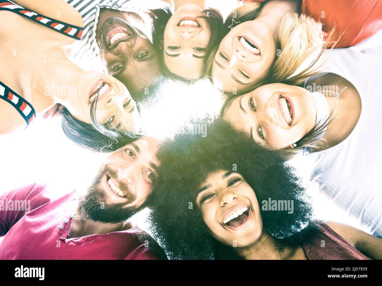 Multicultural best friends millenials taking selfie with back lighting ...