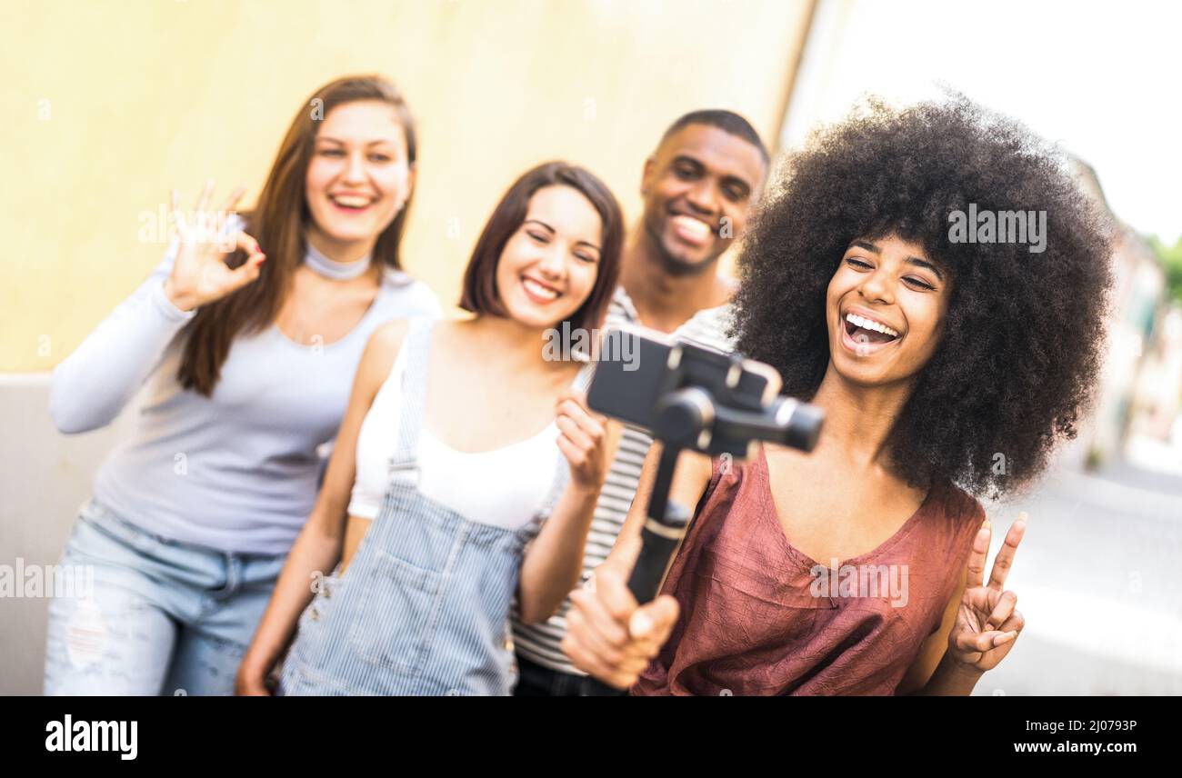 Millennial people taking video selfie with stabilized mobile phone ...