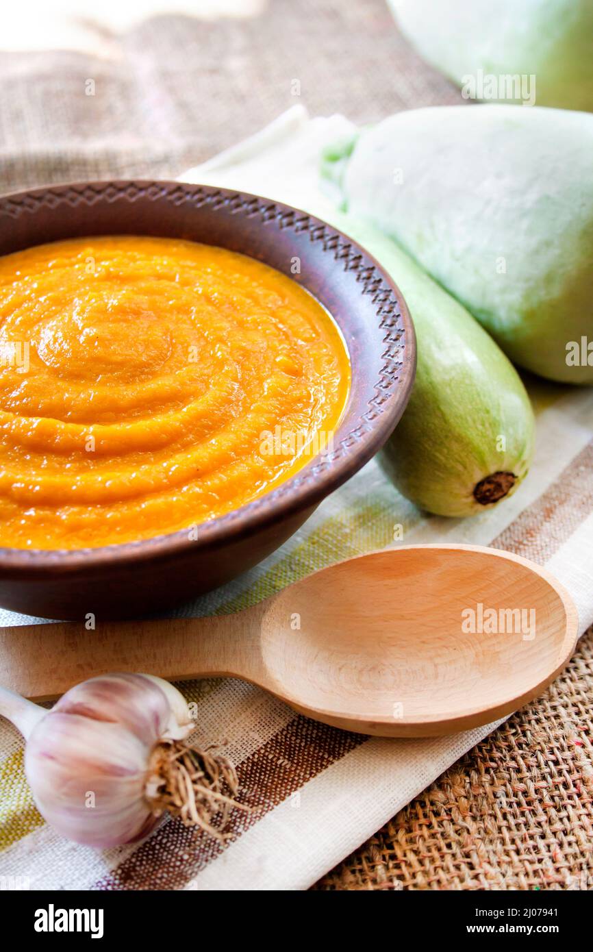 Squash caviar with garlic and tomatoes in a rustic bowl Stock Photo - Alamy