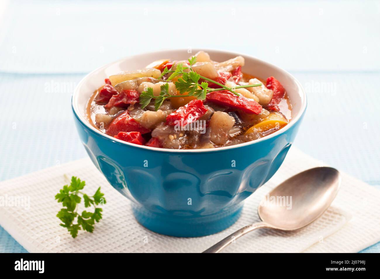 Colorful vegetable stew in a blue bowl Stock Photo - Alamy