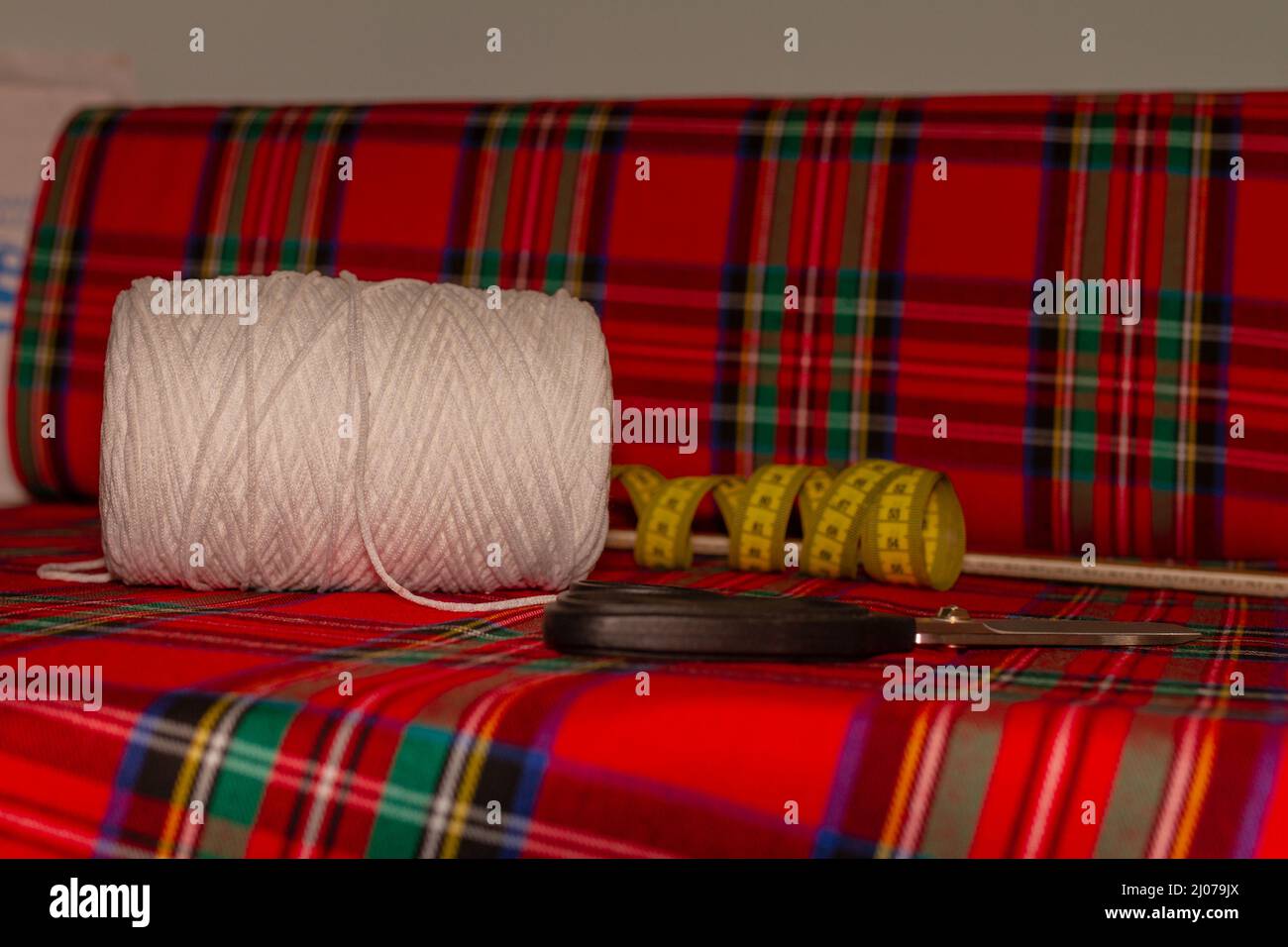 Rope roll, scissors, tape measure and sewing ruler Stock Photo - Alamy