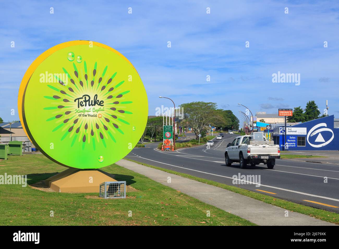 A welcome sign in the shape of a giant kiwifruit slice on the outskirts ...