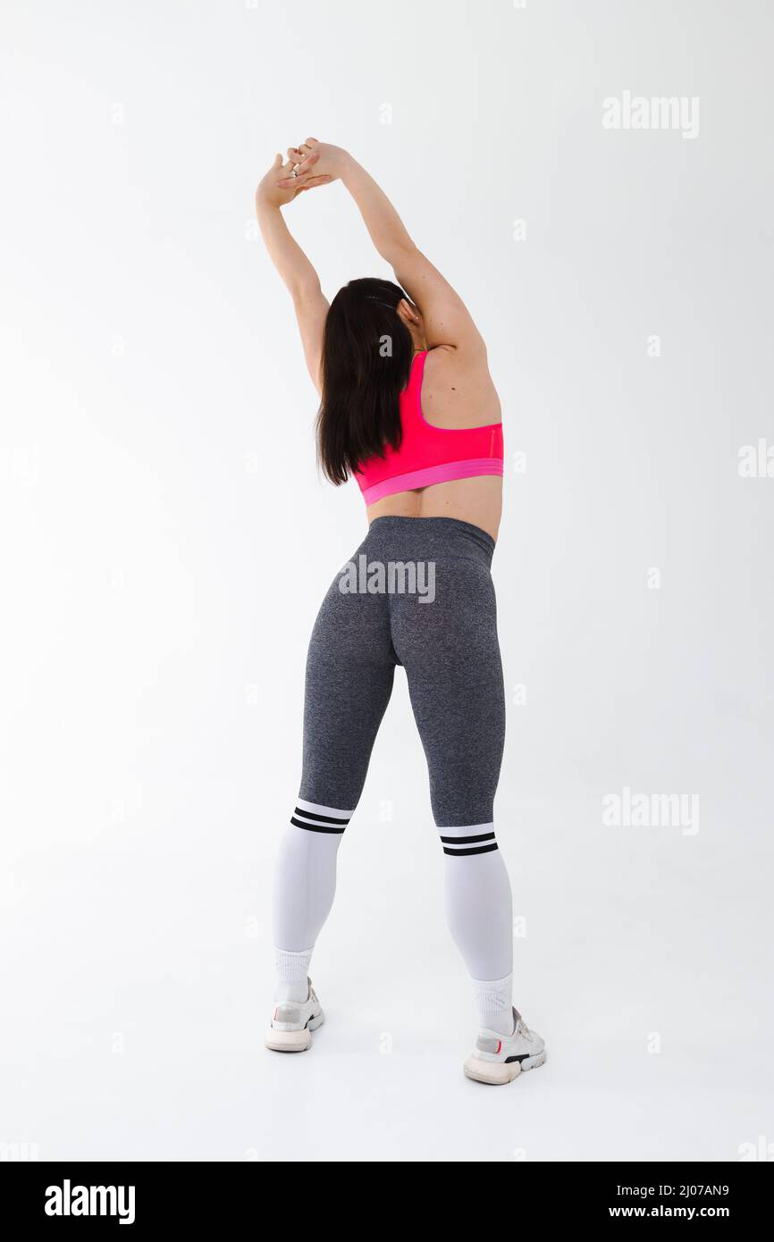 Slender fitness girl is warming up in the studio Stock Photo - Alamy