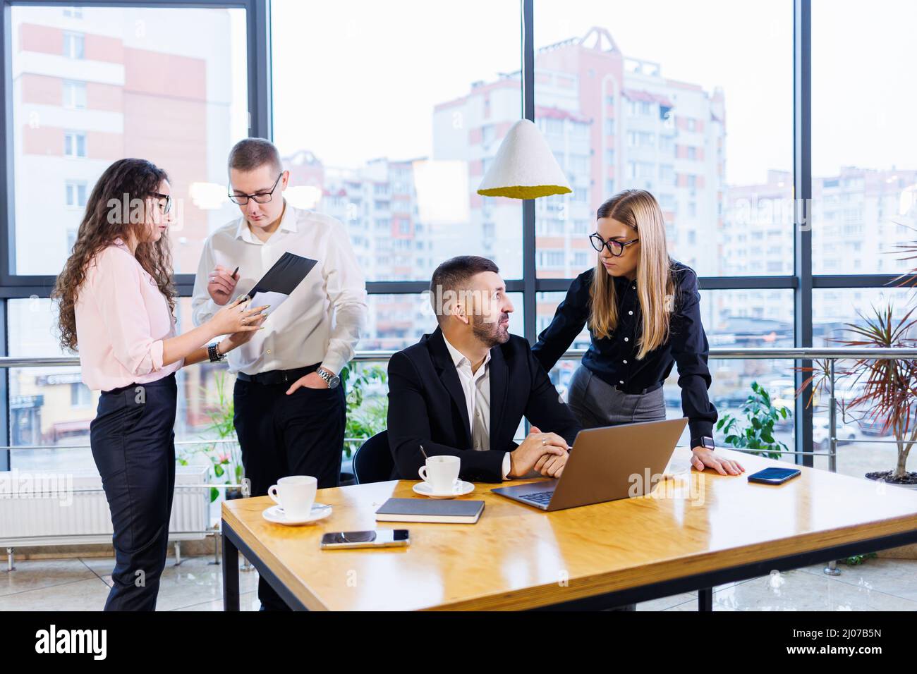 The boss stands with the charts, demonstrates statistics, various ...