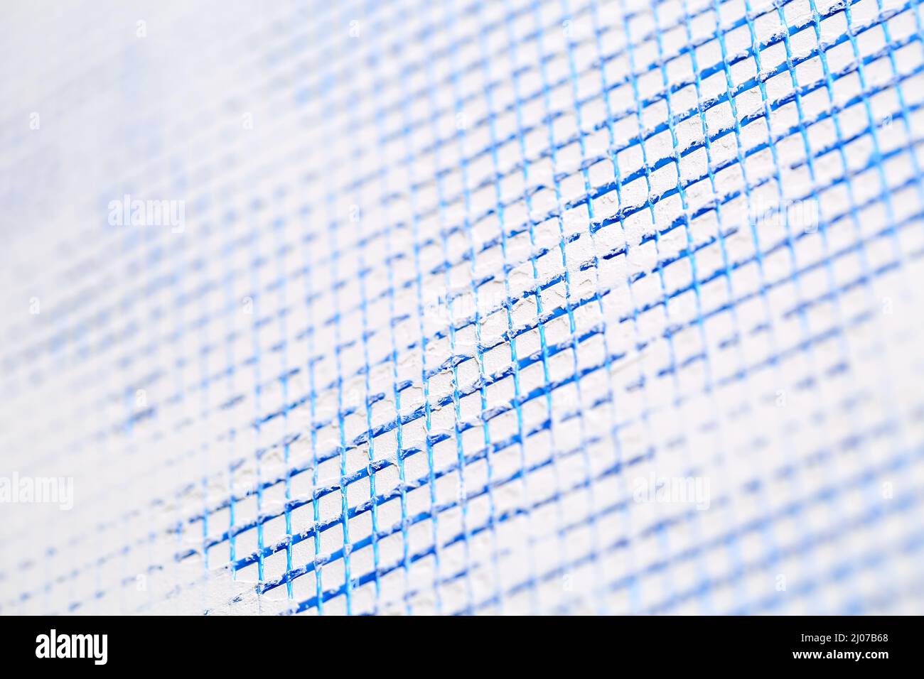 Close up of blue colored plastic (PVC) plastering mesh for reinforcing ...