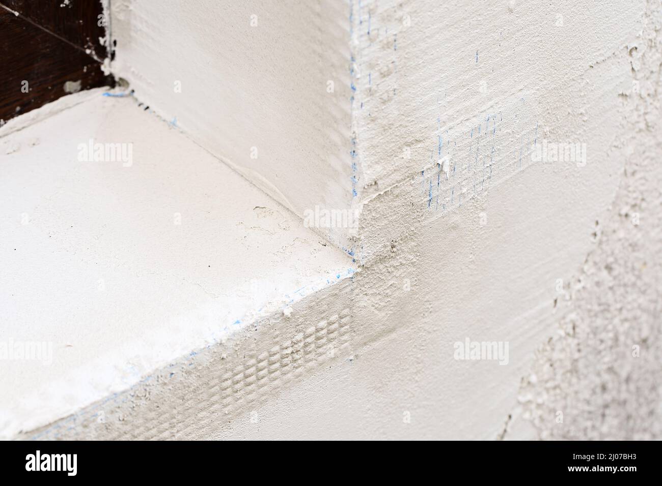 New installed plastering angle beads with plastic mesh on the external ...