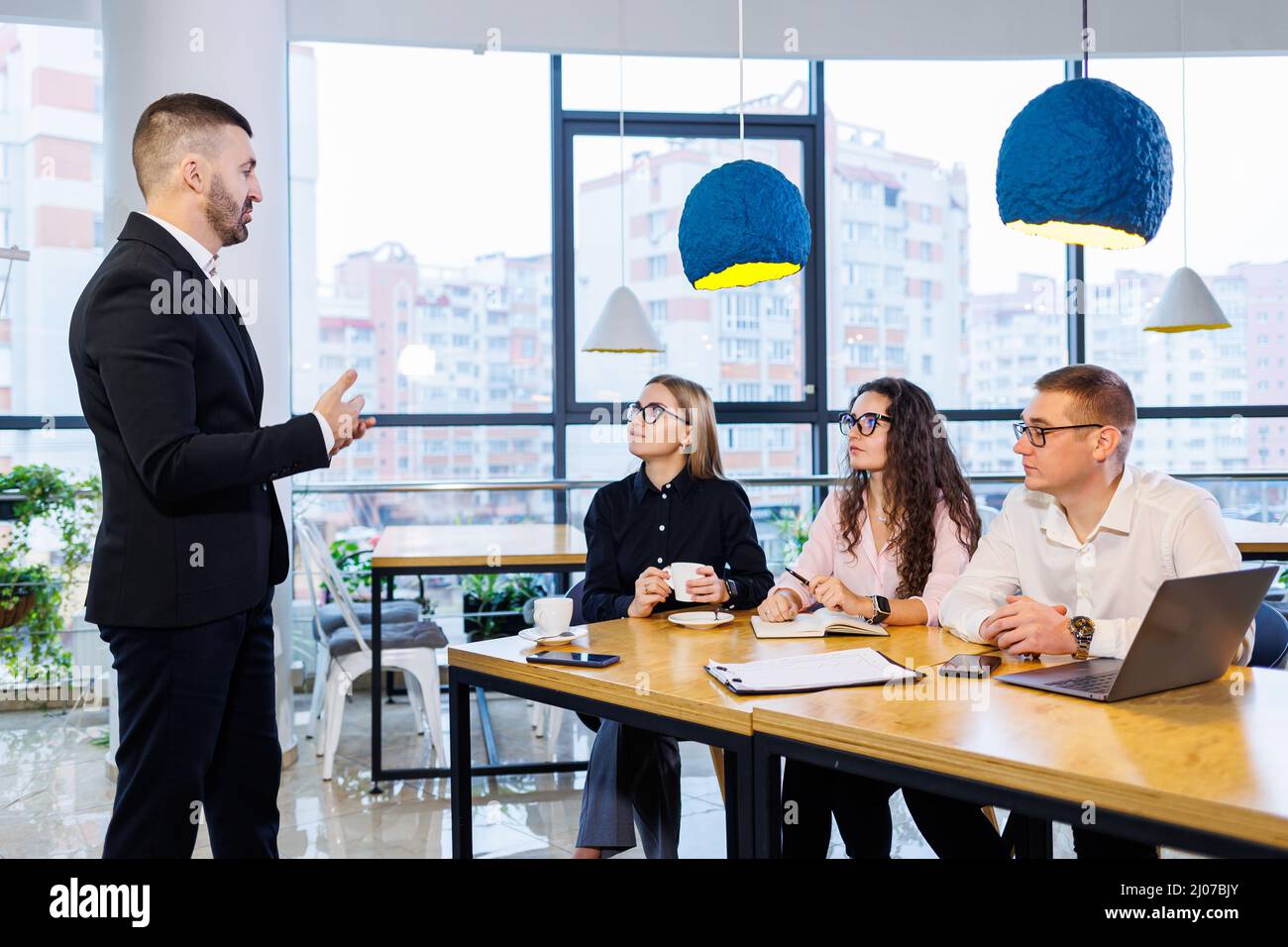 The boss stands with the charts, demonstrates statistics, various ...