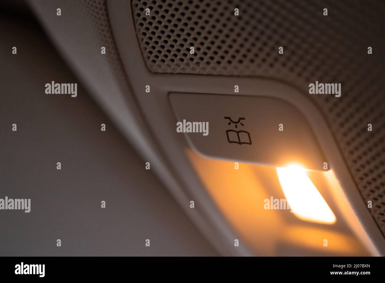 Closeup of cabin lights switch in car, light control panel inside a car ...