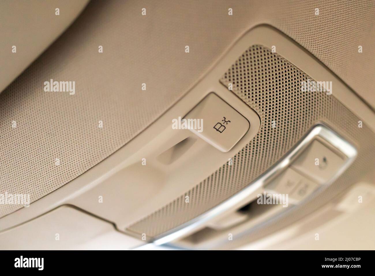 Closeup of cabin lights switch in car, light control panel inside a car ...