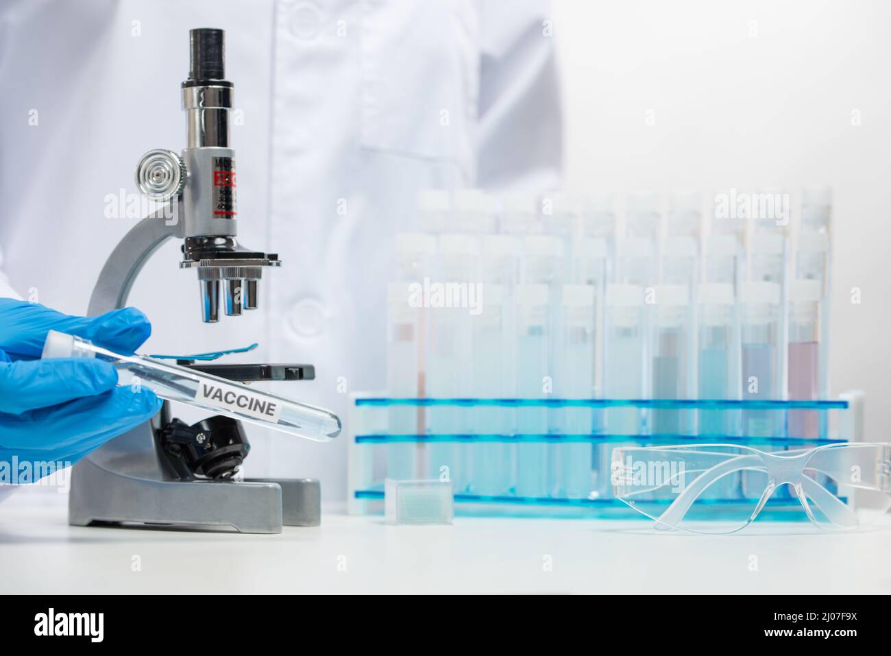 Close-up view of laboratory room with biological tubes and microscope ...