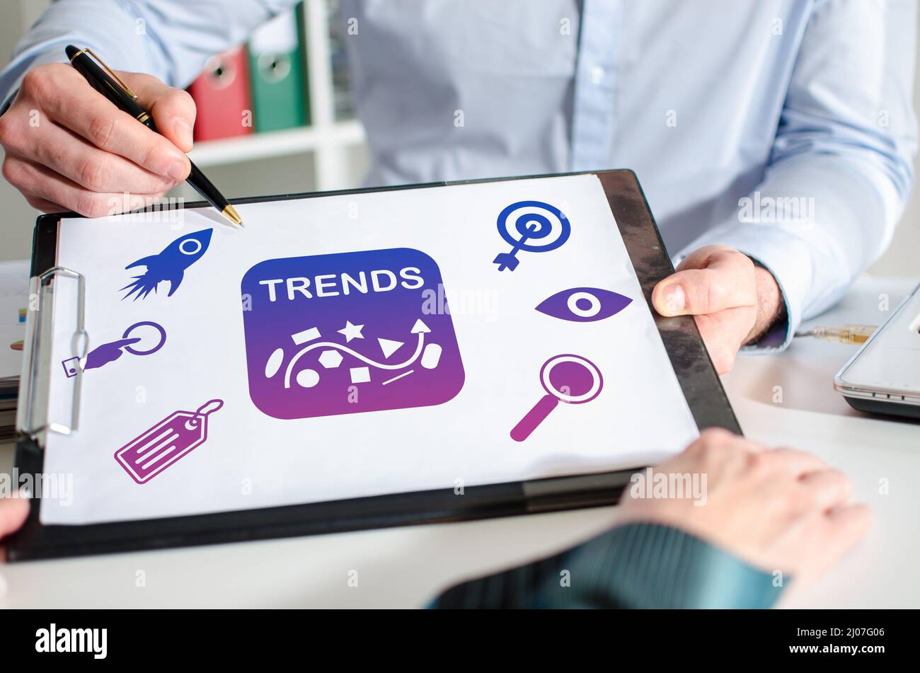 Businessman showing trends concept on a clipboard Stock Photo - Alamy