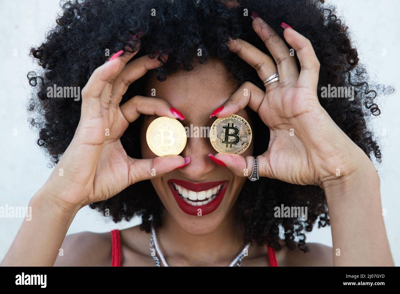 Beautiful Afro-American woman covering her eyes with a pair of cyber ...