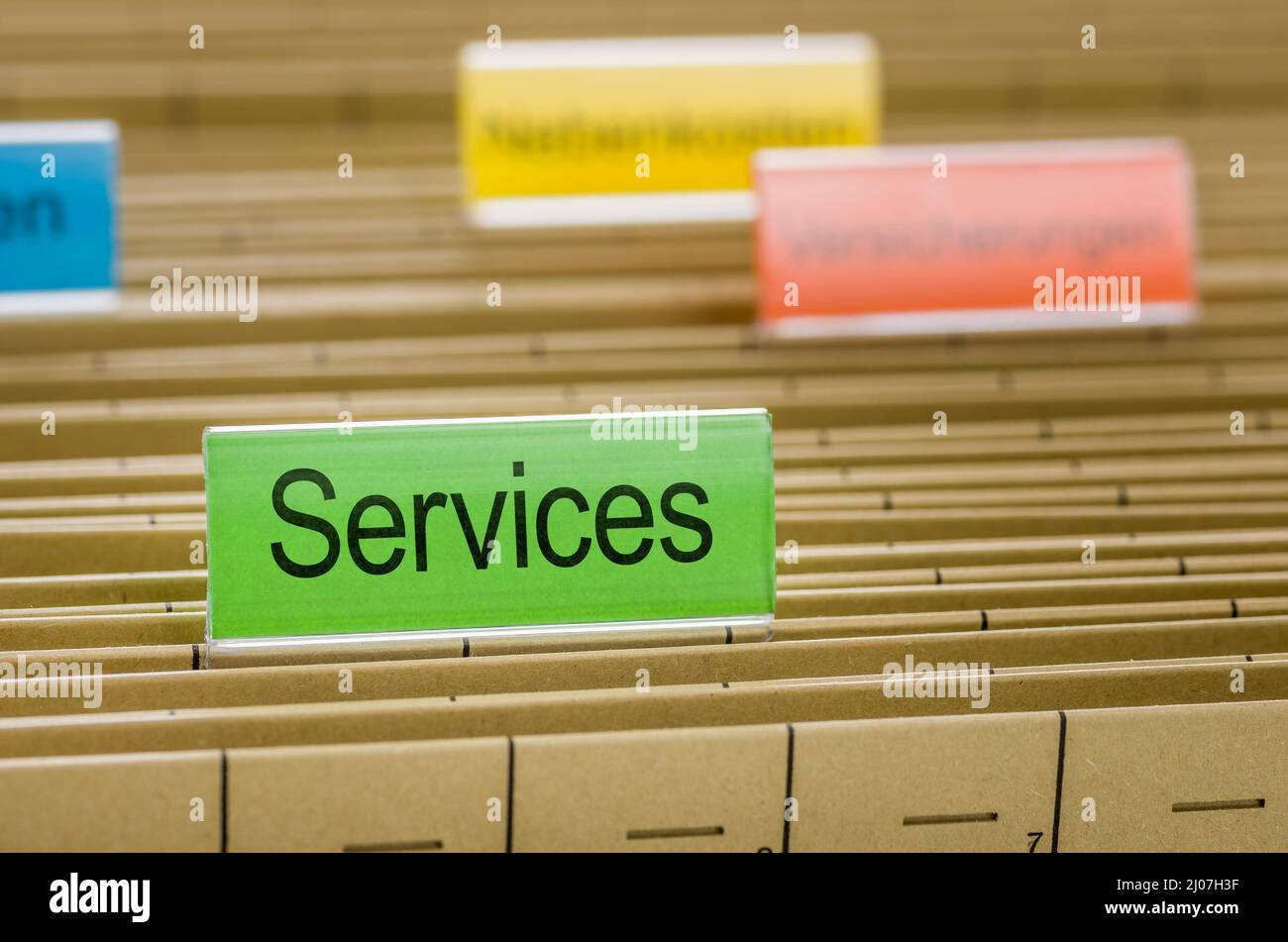 Hanging file folder labeled with Services Stock Photo - Alamy
