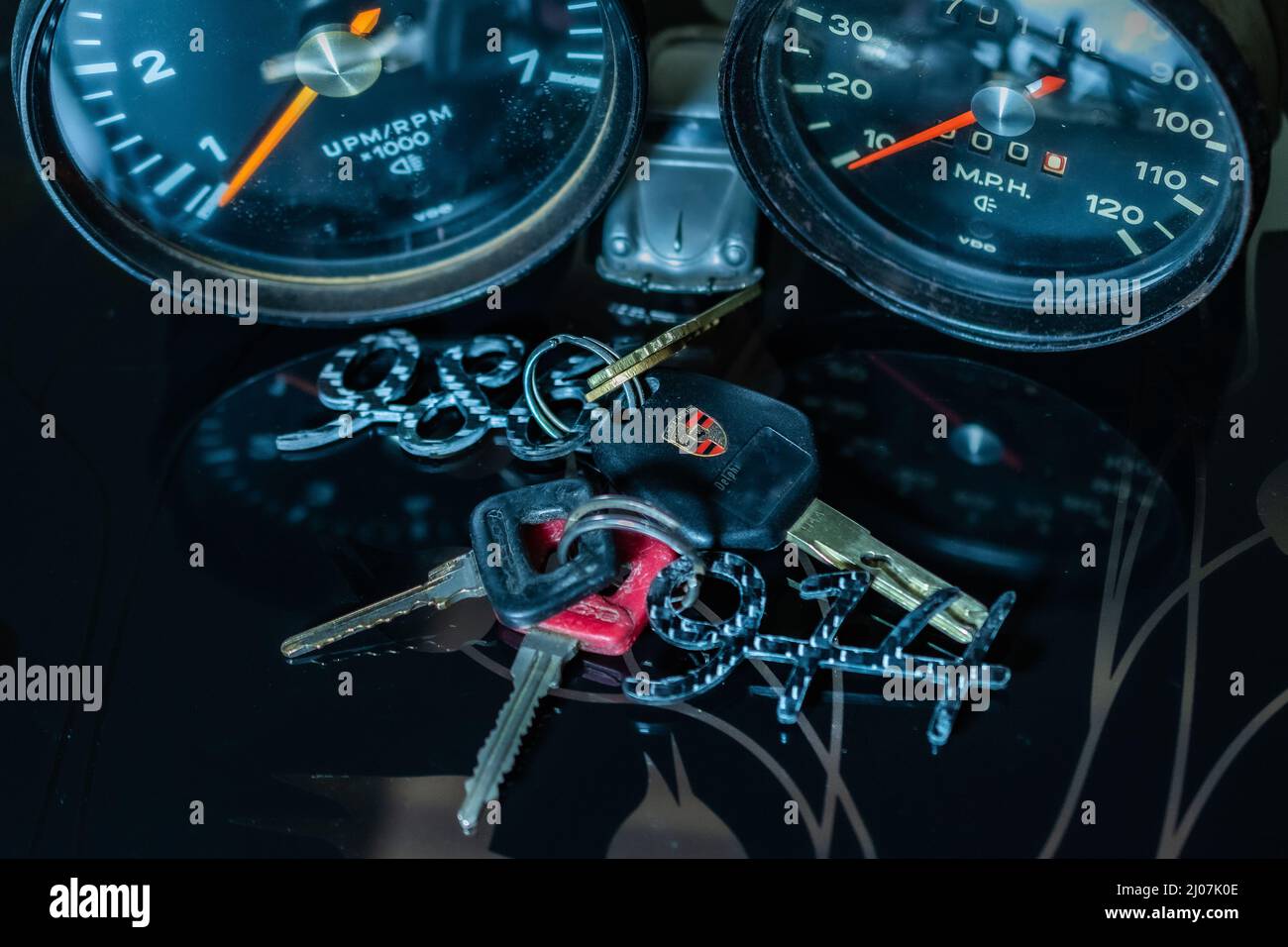 Random objects in the car interior near the speed ometer Stock Photo ...
