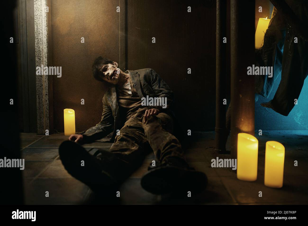 Tired and exhausted zombie sitting on floor Stock Photo - Alamy