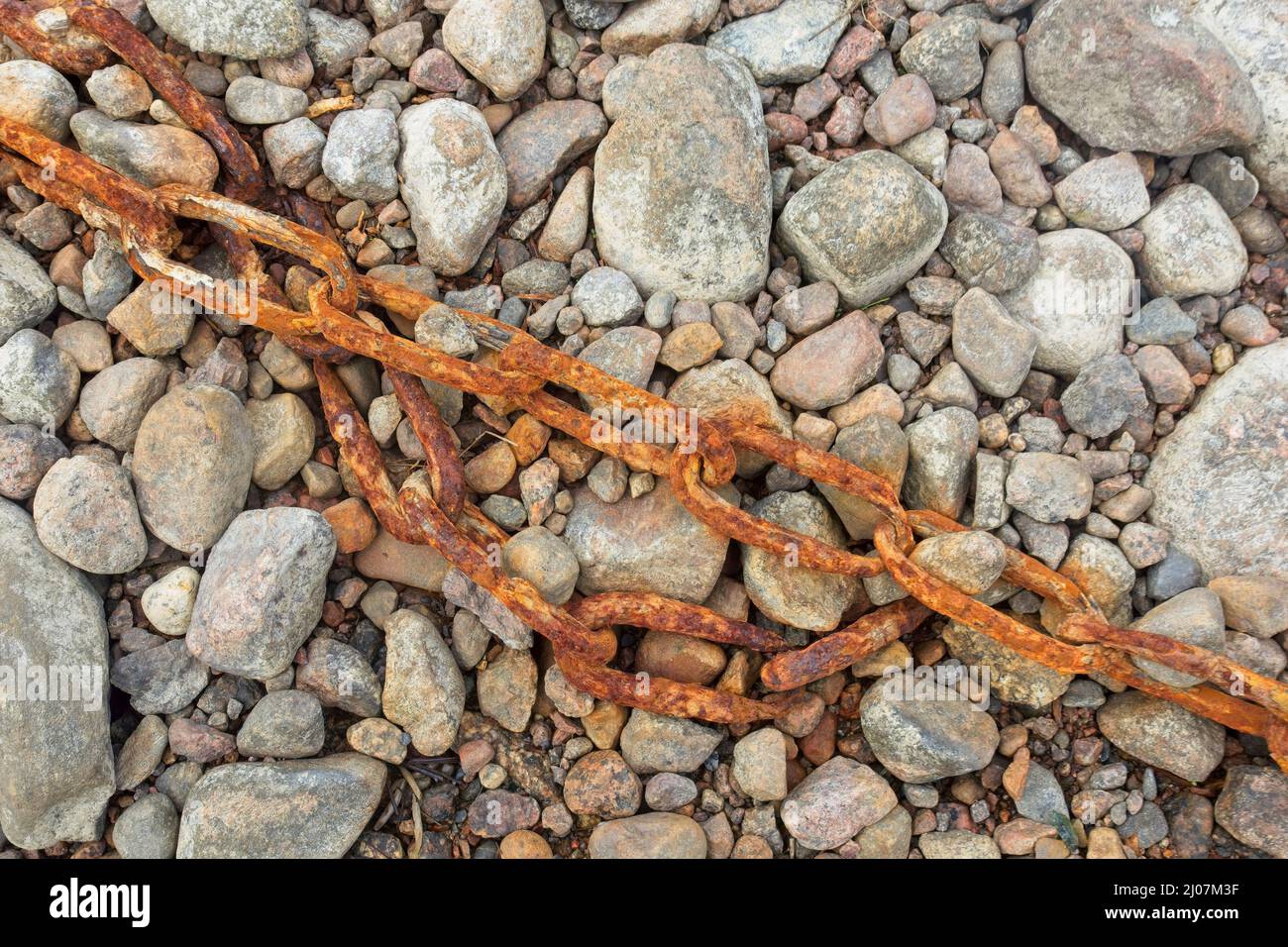 Rusted metal chain on ground Stock Photo - Alamy
