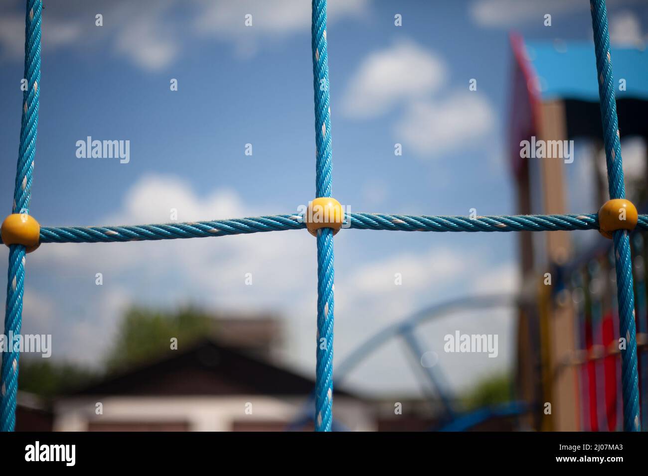Children's playground in detail. Rope ladder in children's area. Blue ...
