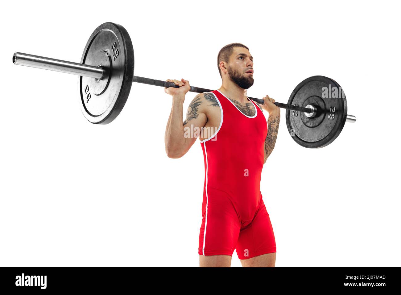 Close-up strong man red sportswear raising barbell up isolated on white ...