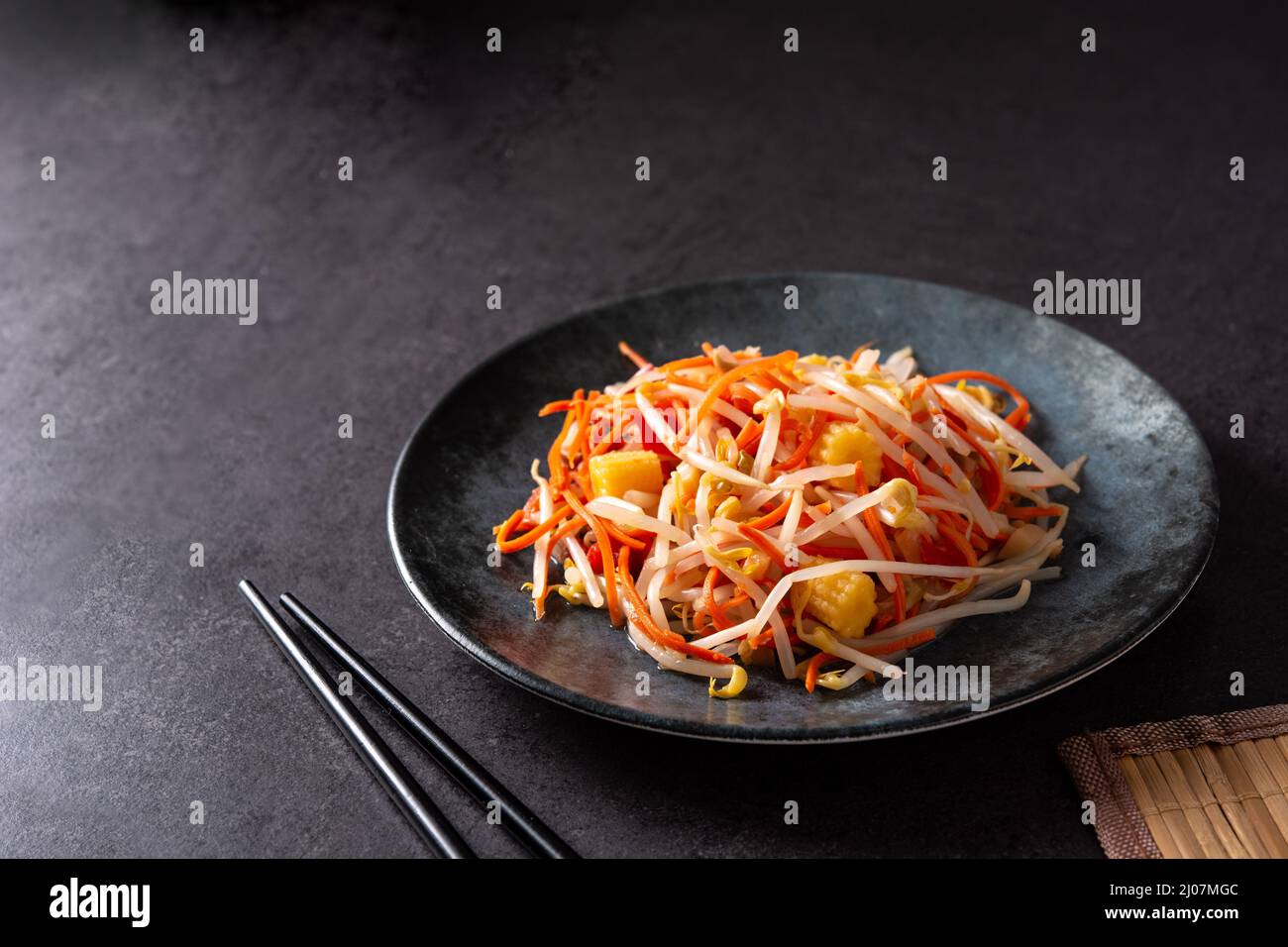 Healthy Chinese cabbage salad in plate on black stone background Stock ...