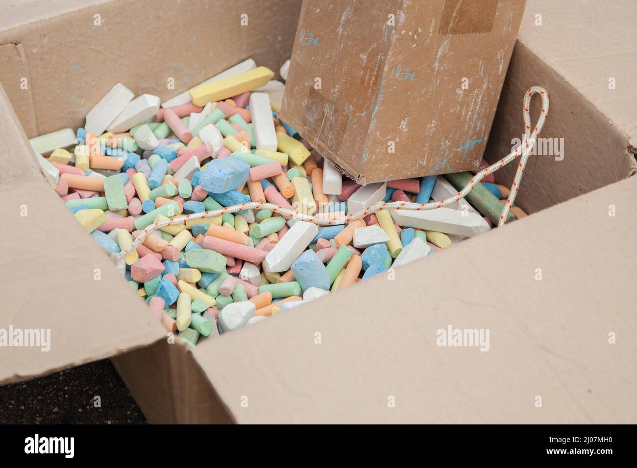 Chalk in box. Multicolored chalk for drawing on asphalt. Lots of ...