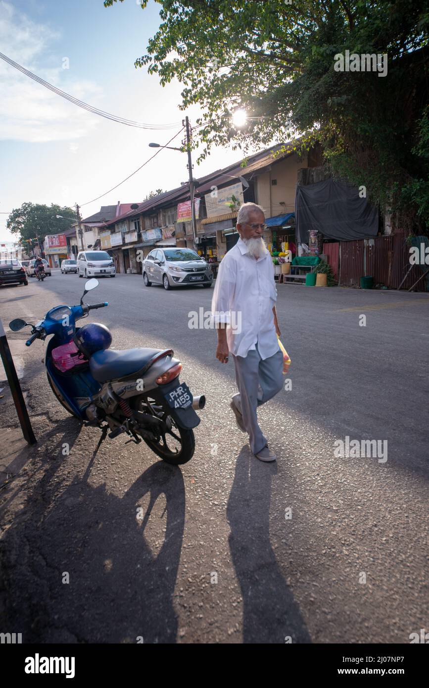 Bagan, Penang, Malaysia - Circa Jun 2017: A man walk at the old street ...