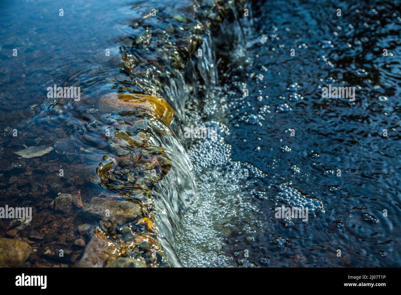 Brook flowing water rocks hi-res stock photography and images - Alamy