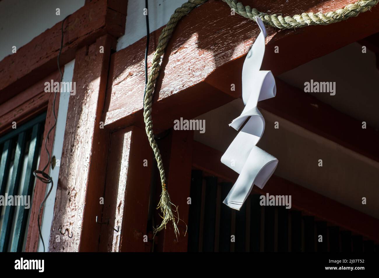 Close up detail of Japanese paper zig-zag Shide streamer hanging ...