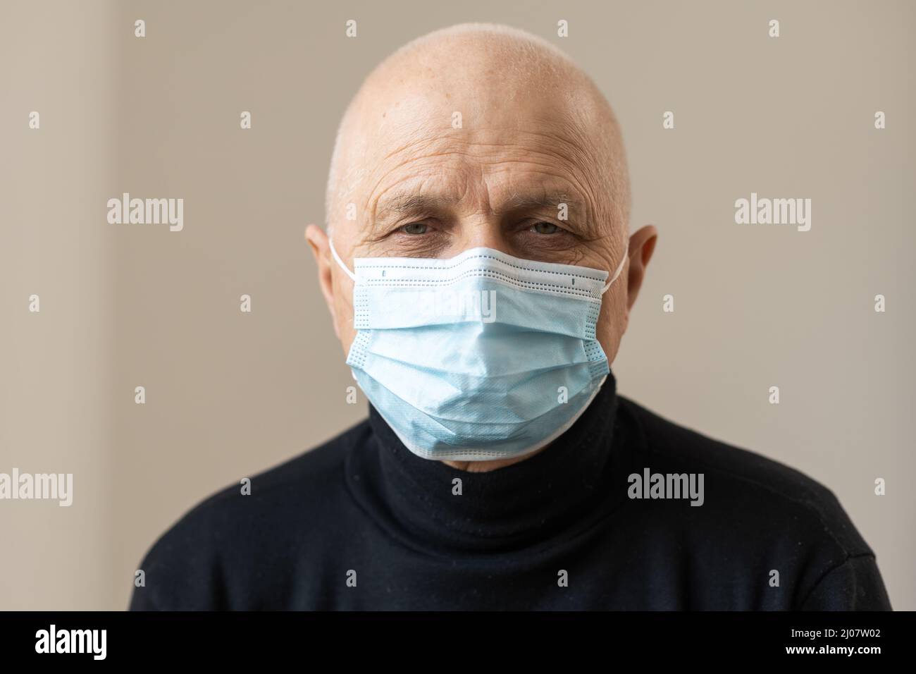 Elderly man at home mask isolation Stock Photo - Alamy