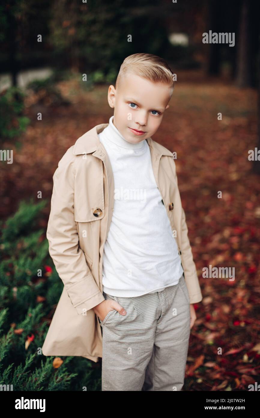 Stylish boy in a coat in autumn in the park, autumn forest Stock Photo ...