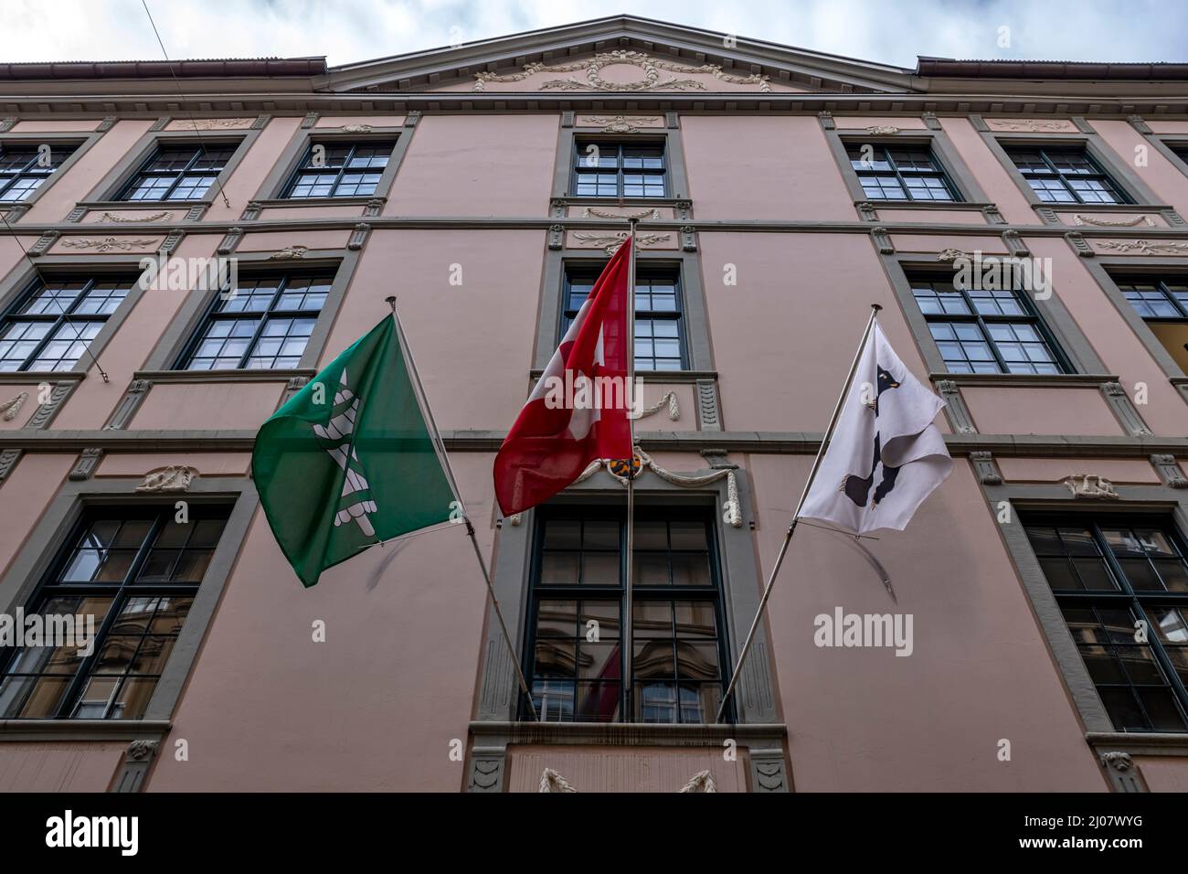 Swiss and Canton Flags Hanging on Facade Building in a Windy Day in St ...