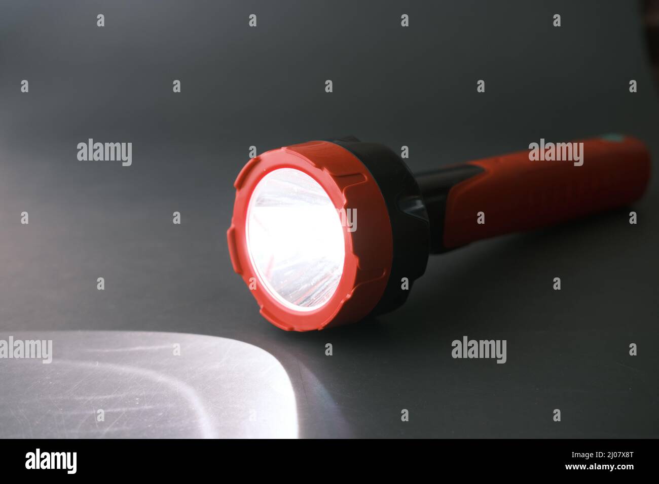 a tourch light on a black background Stock Photo - Alamy