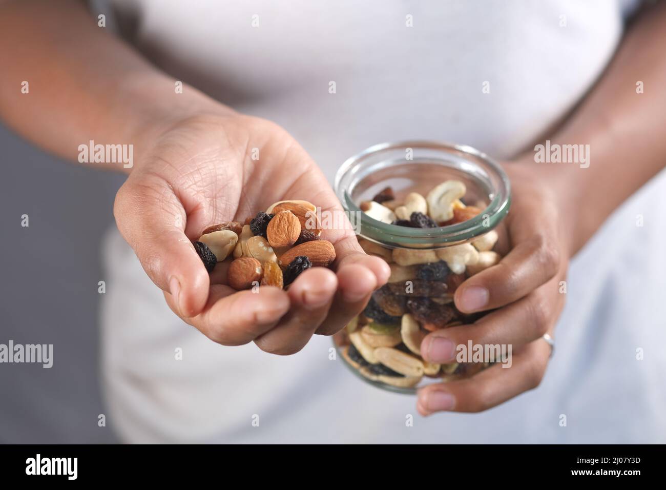 Young man eating almond hi-res stock photography and images - Alamy
