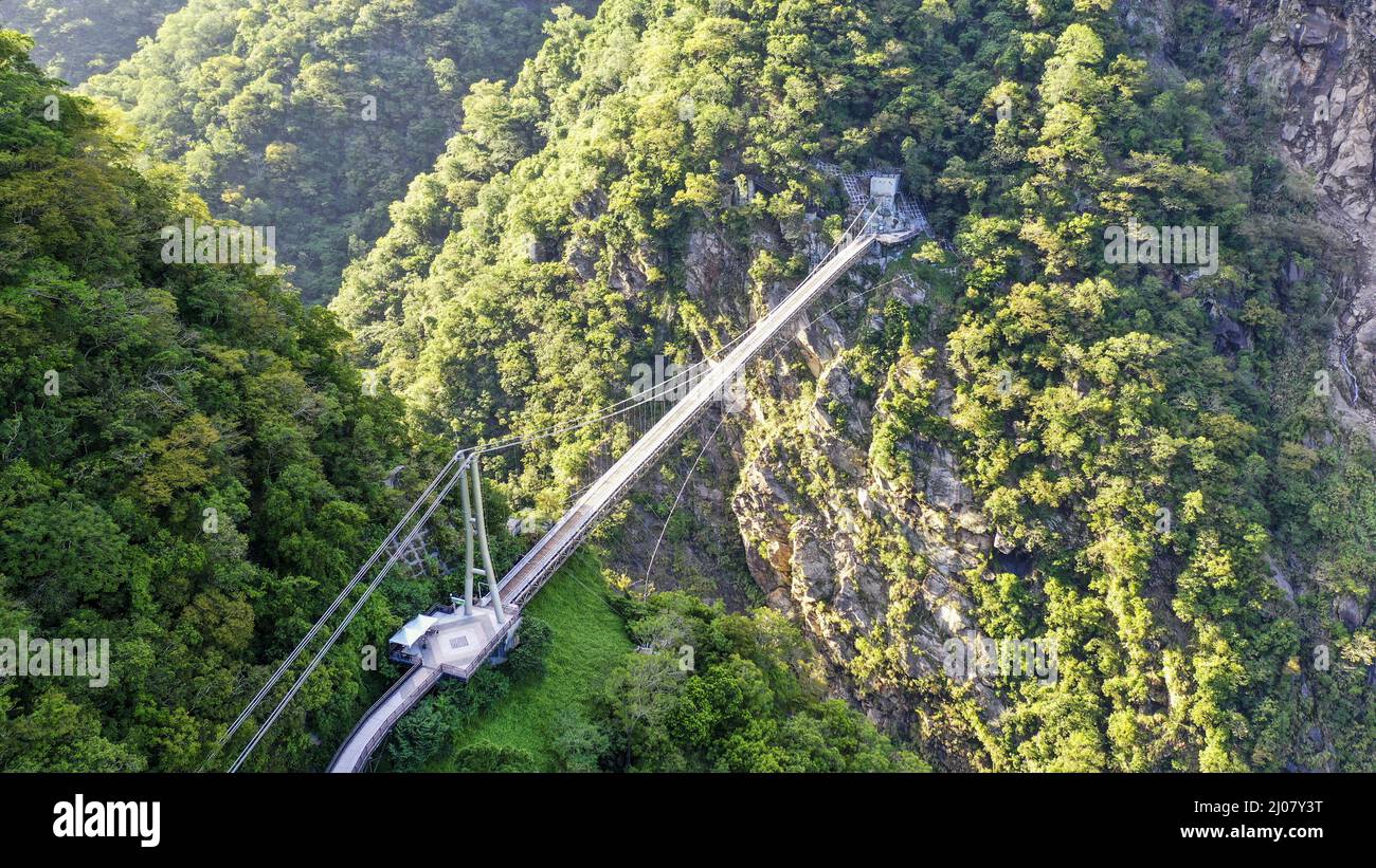 Shot of bridge that connects two montains Stock Photo - Alamy