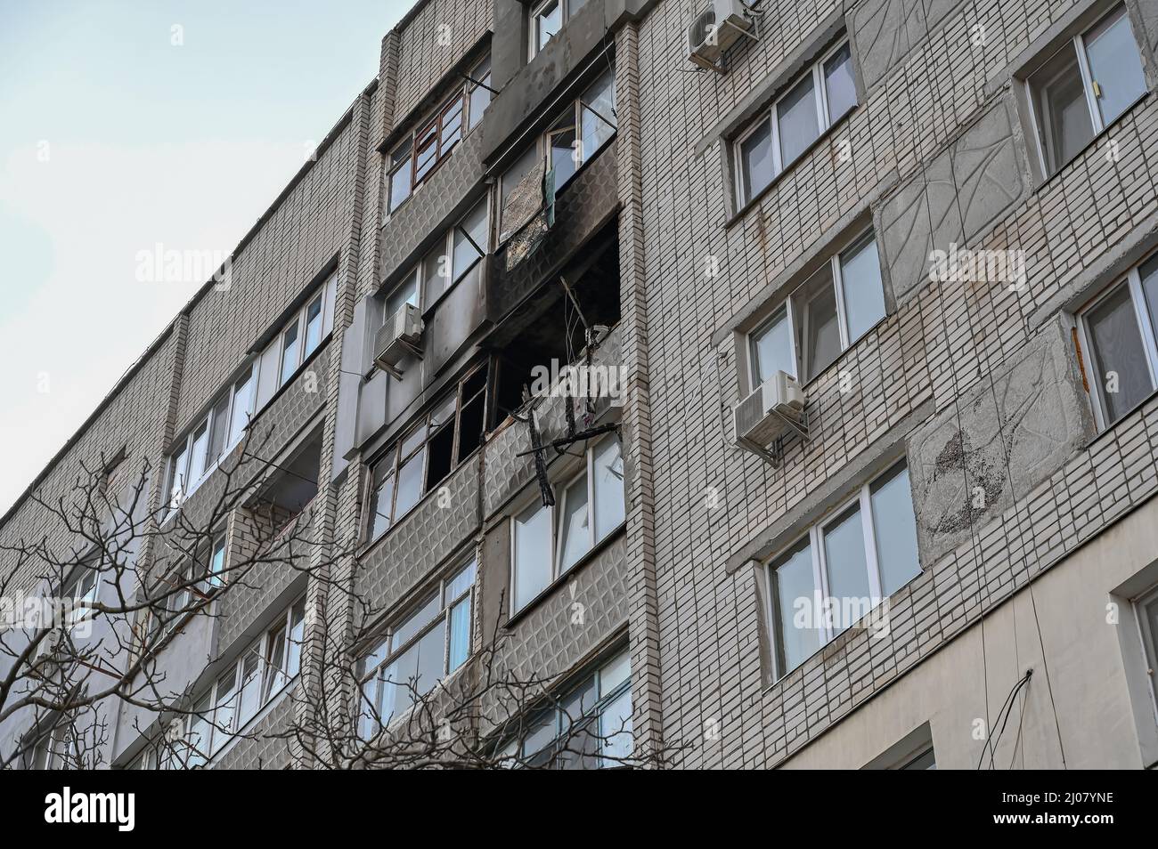 An extinguished fire in an apartment building. Burnt balcony with ...