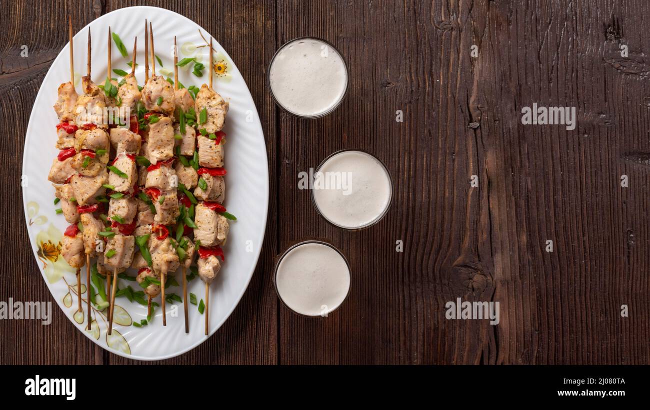 Barbecue with barbecue and beer outdoors. menu of the summer terrace of ...