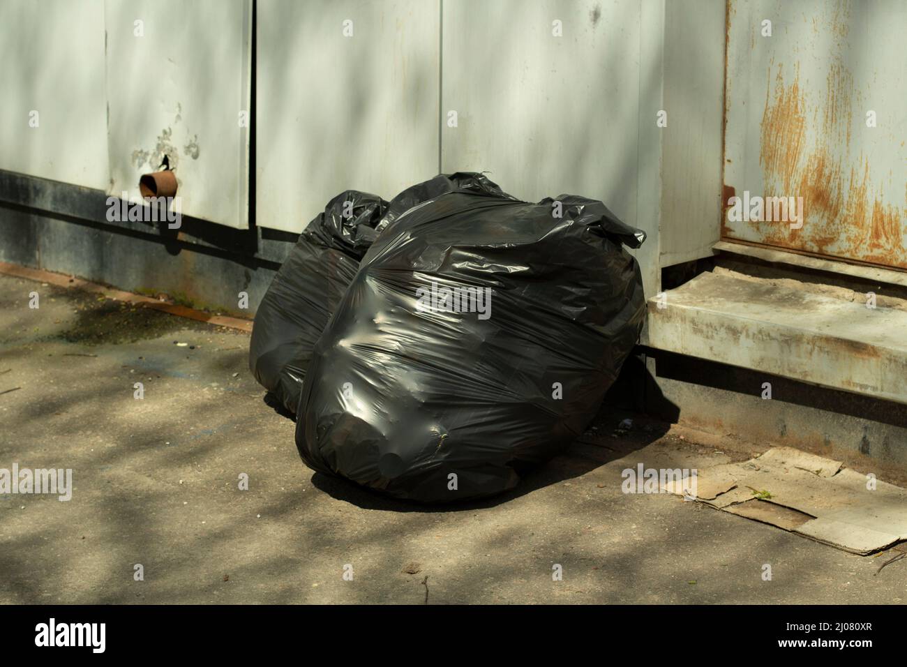 Garbage in bags. Black bags of waste. Plastic bags. Garbage collection ...