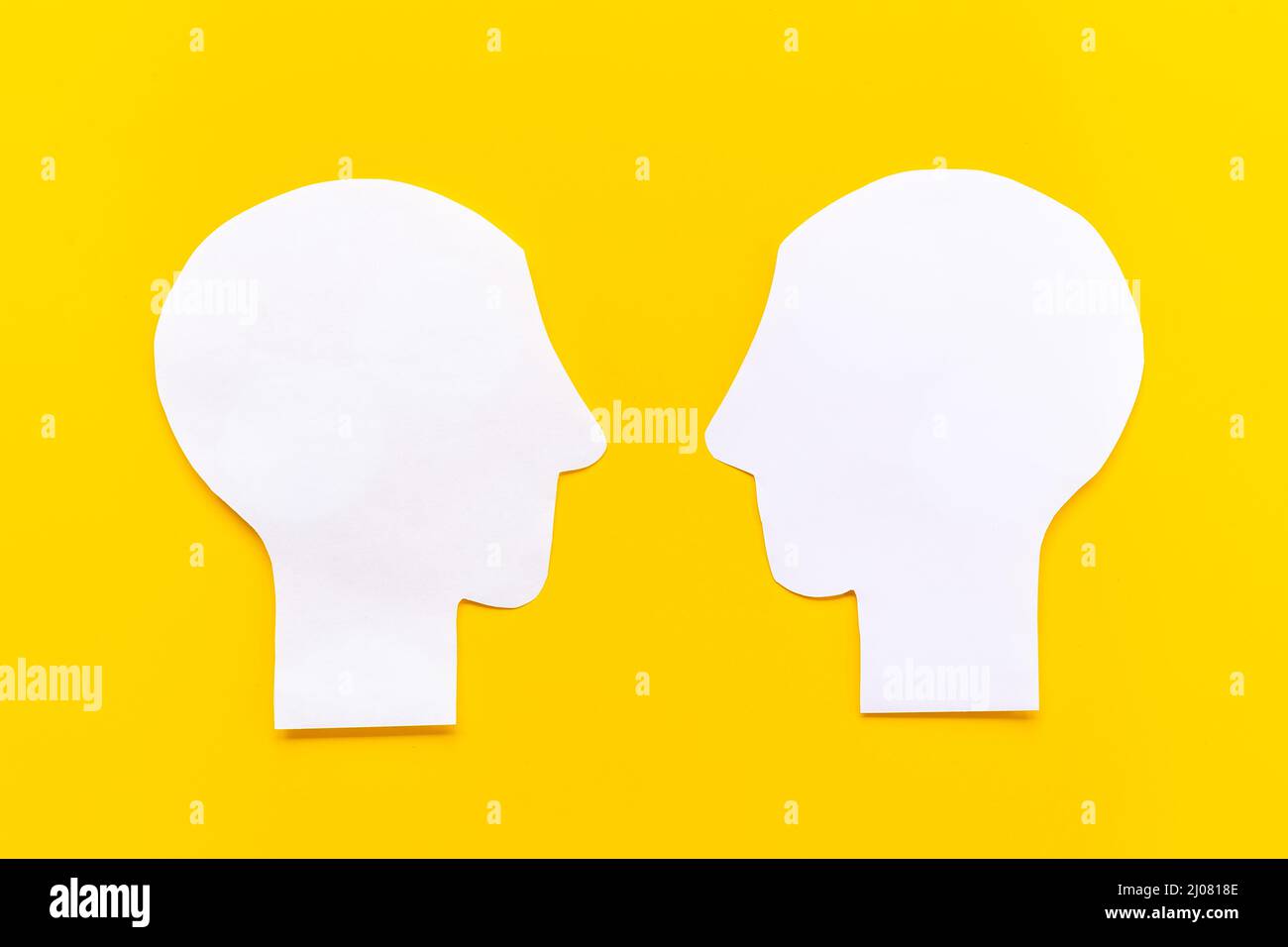 Human communication concept with two paper human heads Stock Photo - Alamy