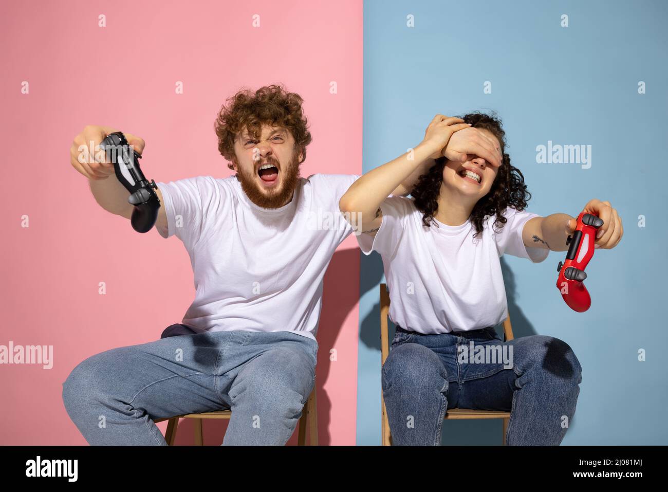 Married couple, young emotive man and girl isolated on blue and pink ...