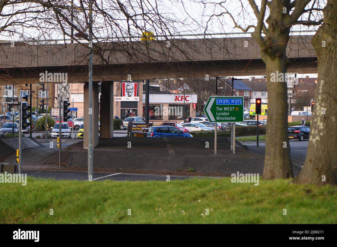 KFC fast food restaurant situated next to a major road roundabout ...