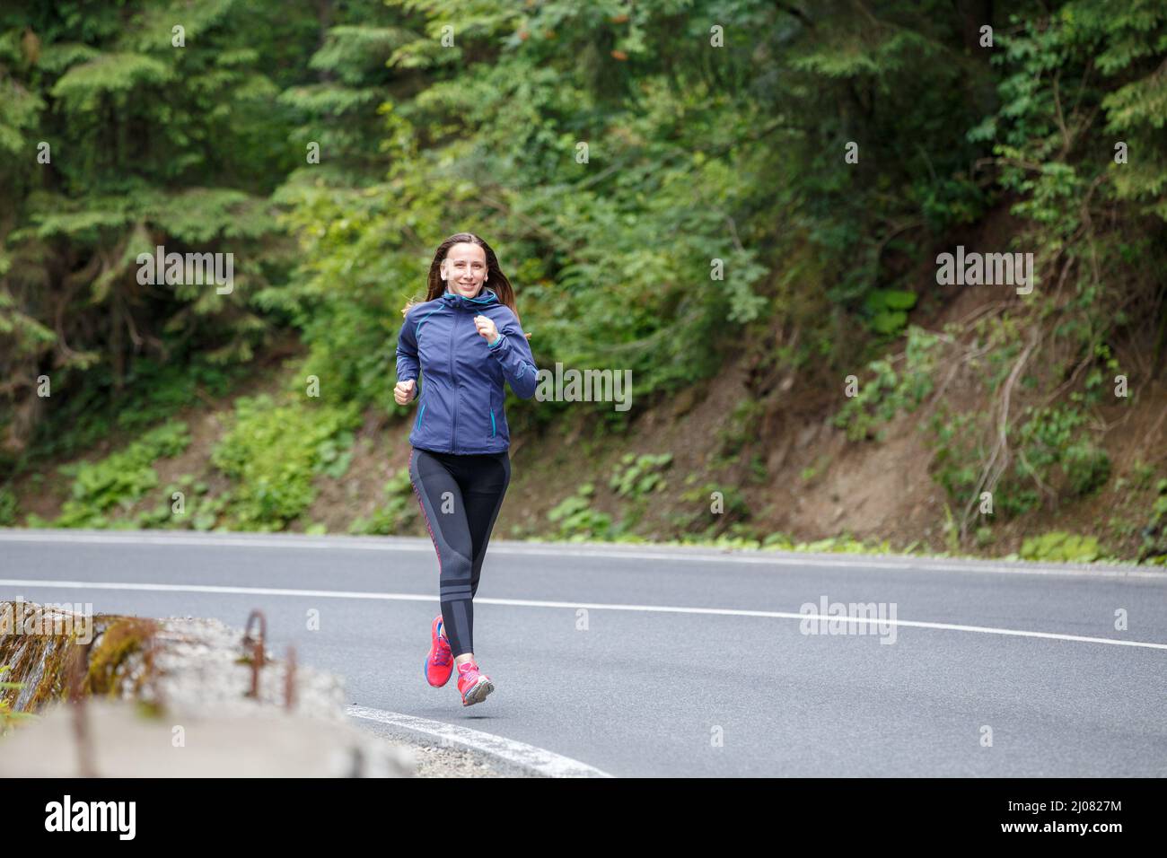 Road running through mountain hi-res stock photography and images - Alamy