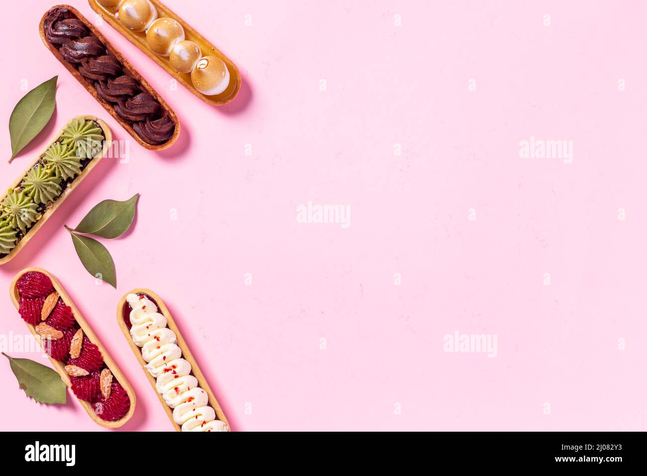 Bakery banner background of eclairs colorful topping Stock Photo - Alamy