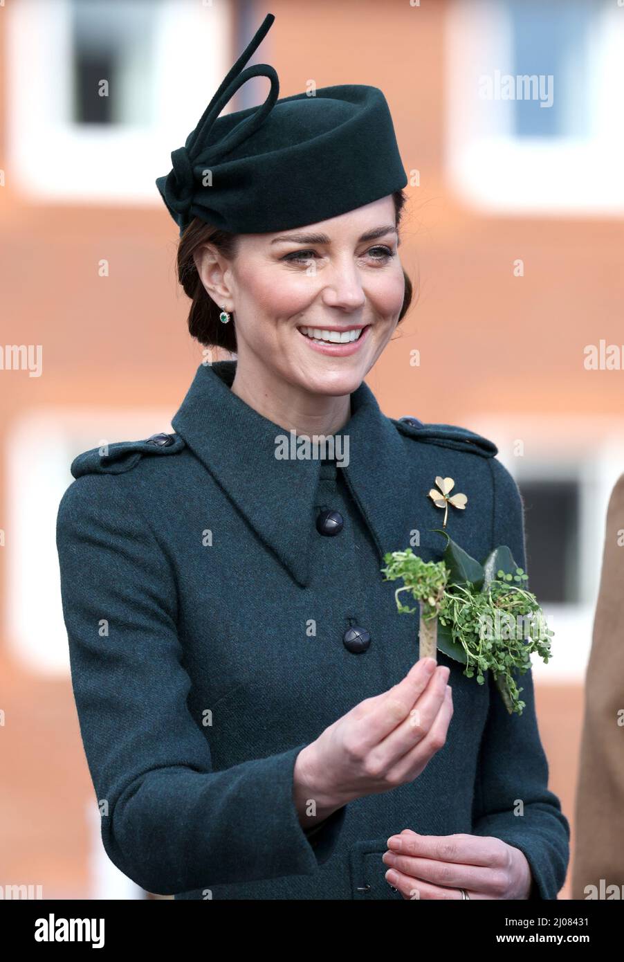 The Duchess of Cambridge presents the traditional sprigs of shamrock to ...